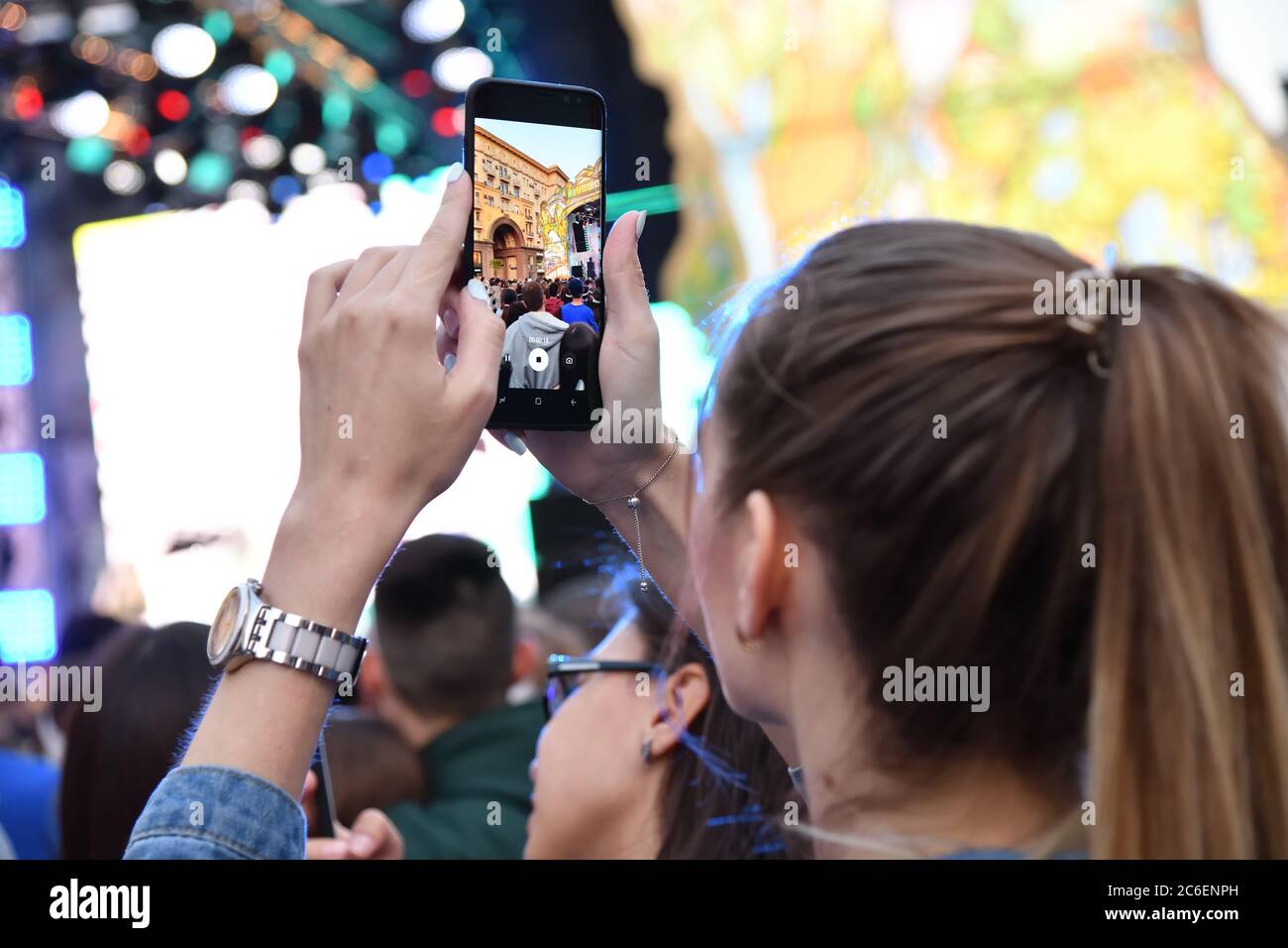 Moscow, Russia - Sept 7, 2019: Girl filming on smartphone a festive ...