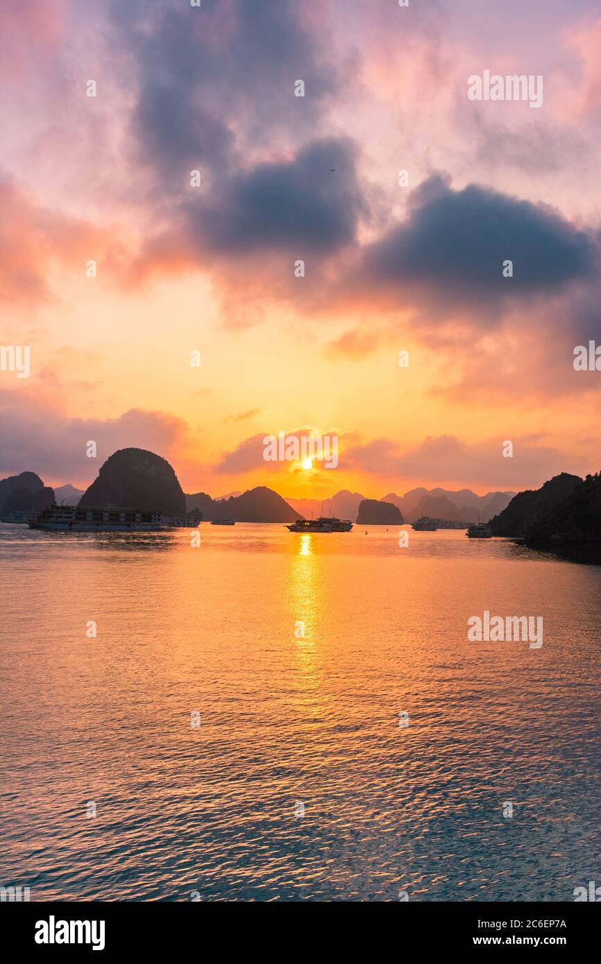Amazing sunset over Ha Long Bay, Vietnam Stock Photo - Alamy