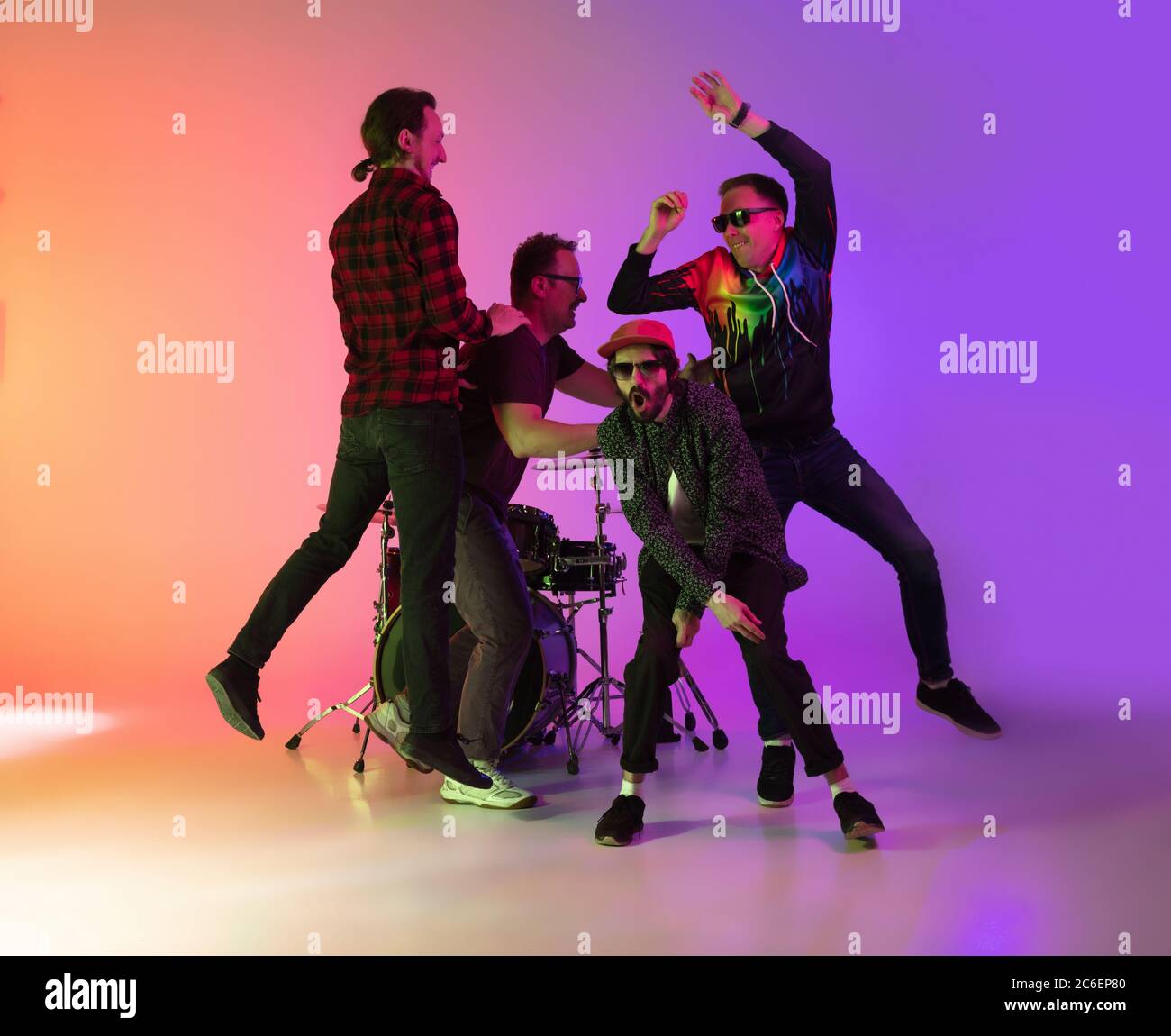 High jump. Young inspired and expressive music band performing on ...