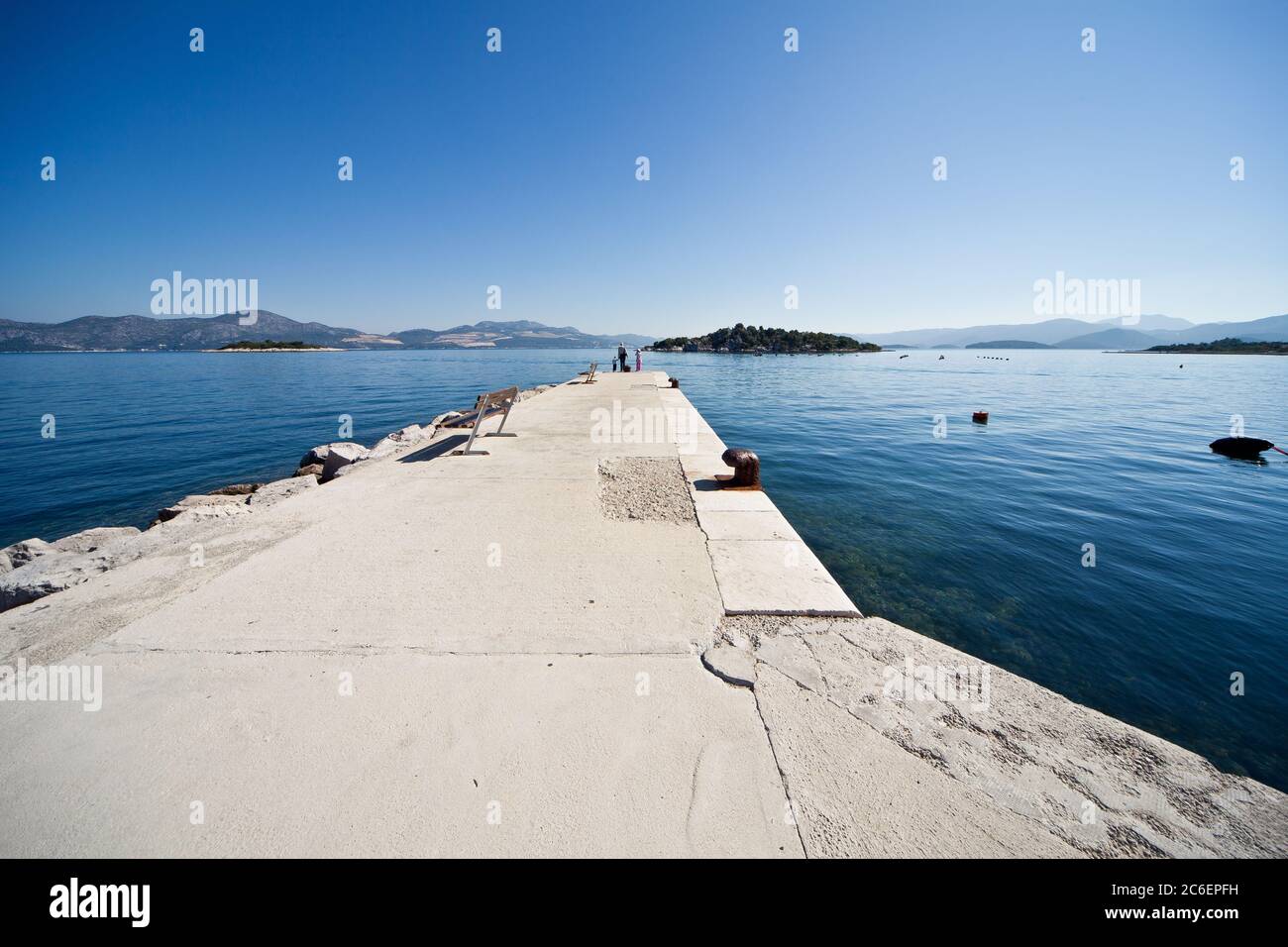 Stone pier in mediterranean village Stock Photo - Alamy