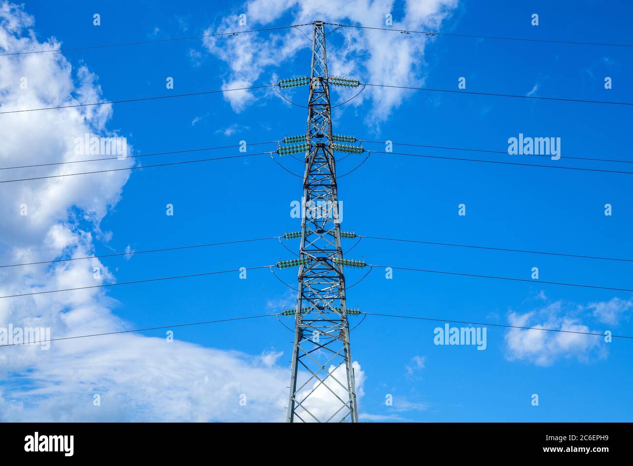 Electrical powerlines and blue sky with clouds Stock Photo - Alamy