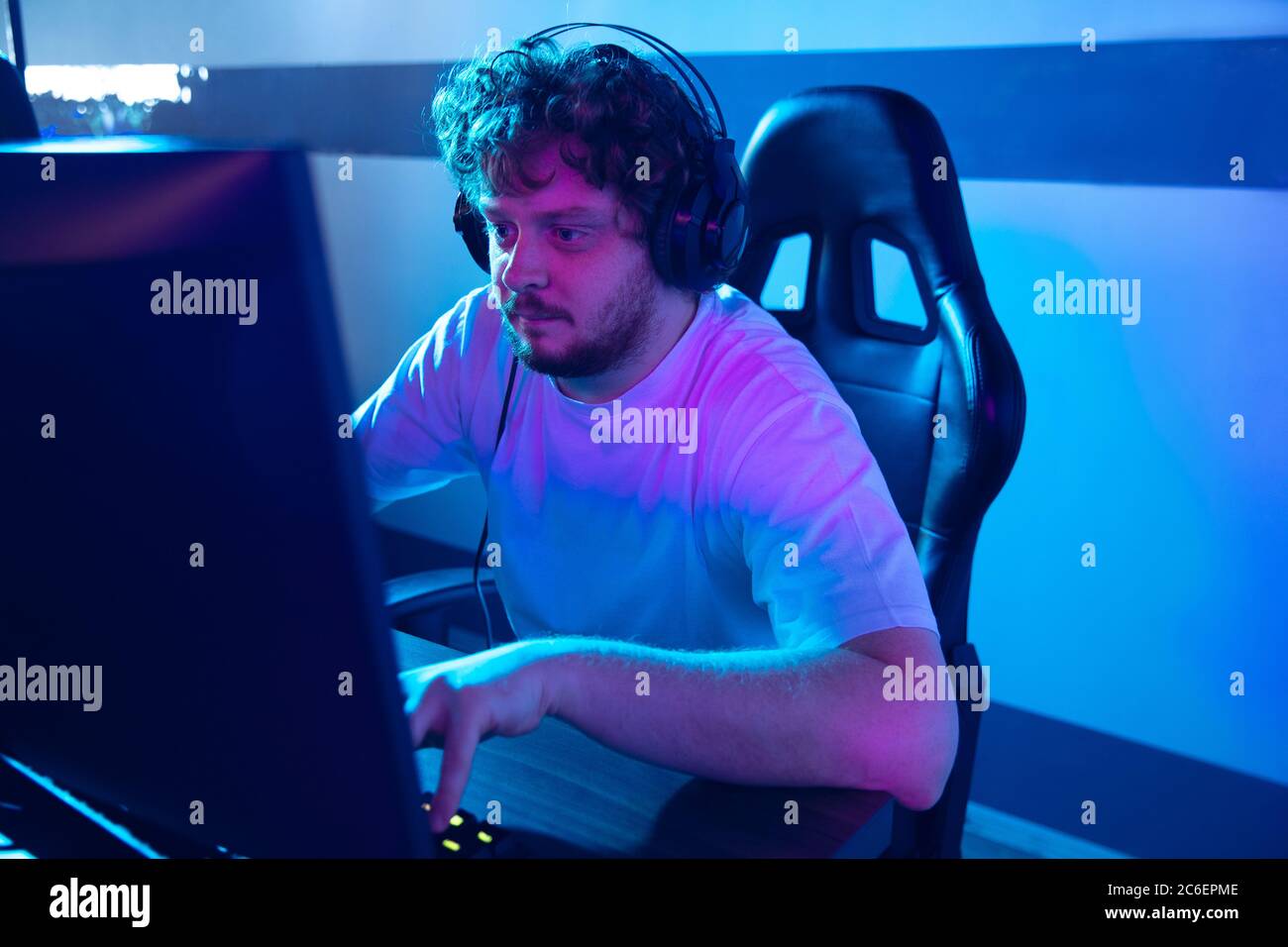 Cyber sport. Fully concentrated professional cybersport gamer playing ...