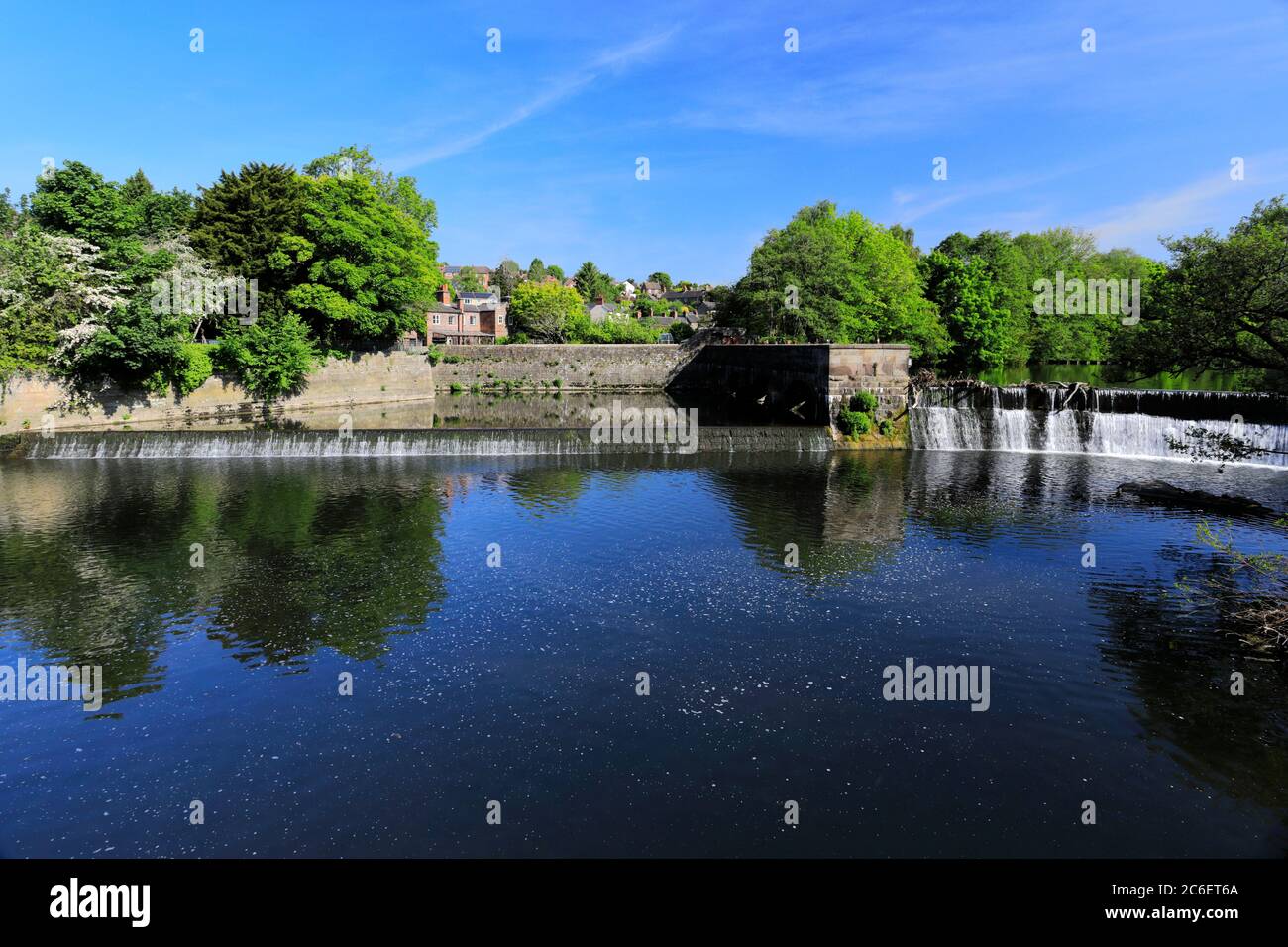 Spring view of the Belper bridge and weir, river Derwent, Belper town ...