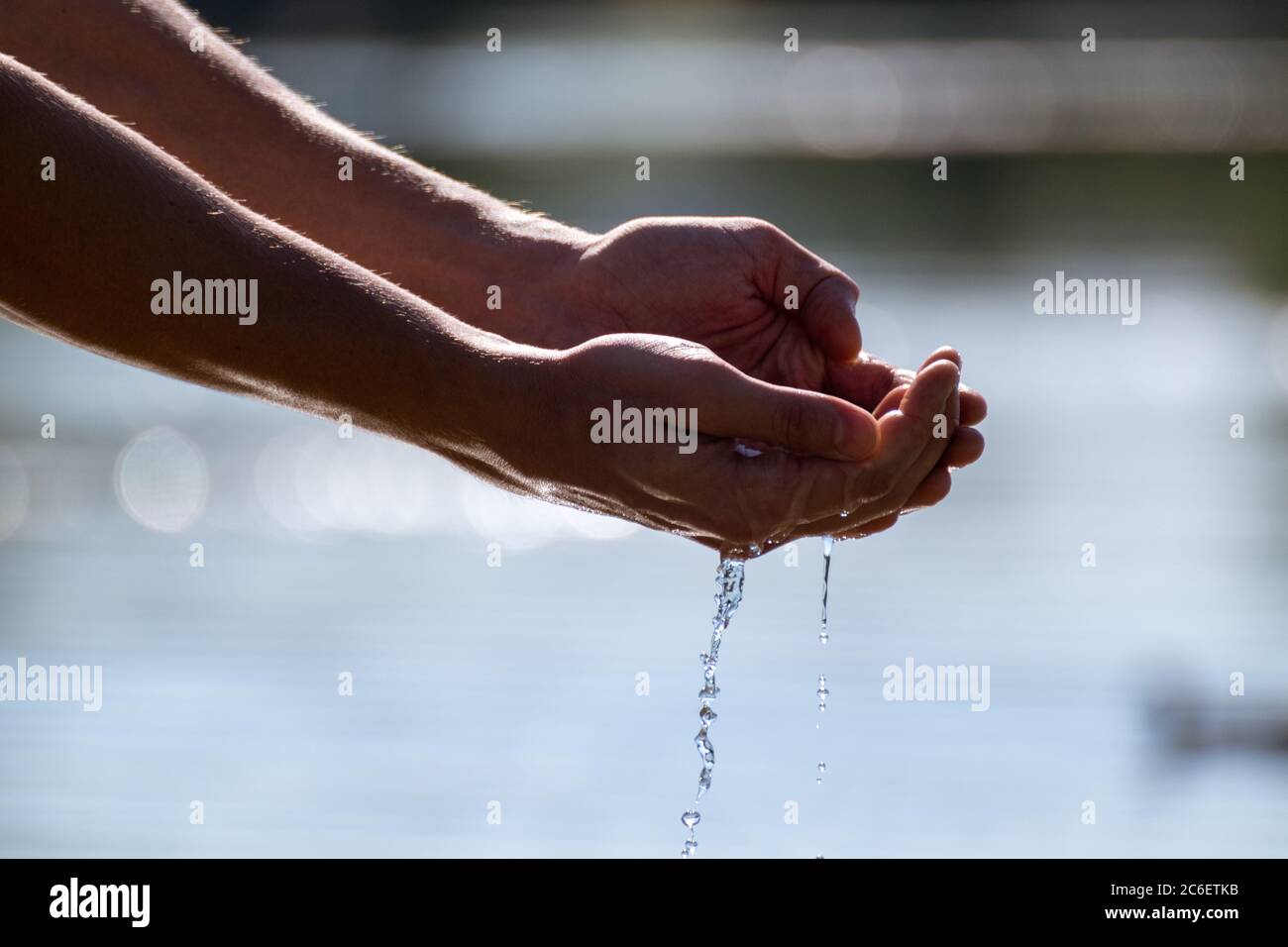 Hand Cupping Dripping Water