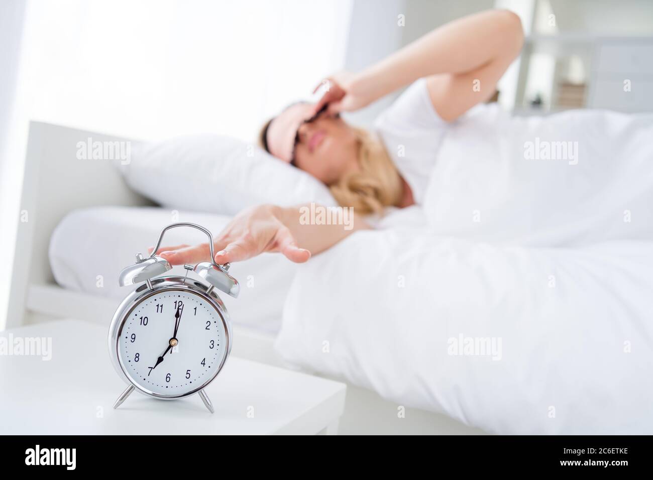Profile photo of displeased lady lying sleeping bed white sheets ...