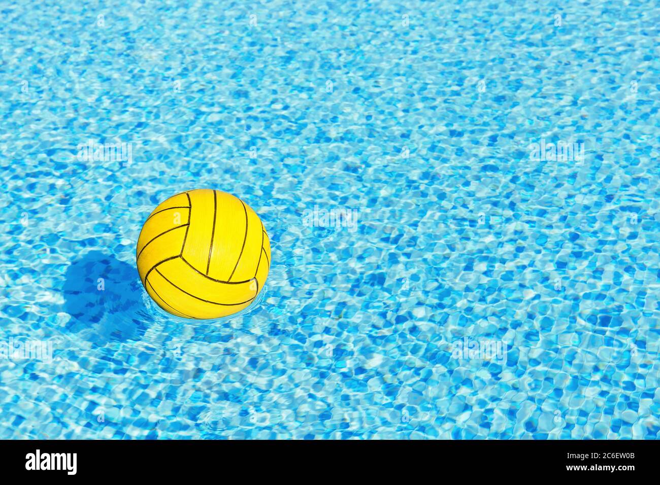 Yellow pool ball in a blue swimming pool. Summer vacation concept Stock ...
