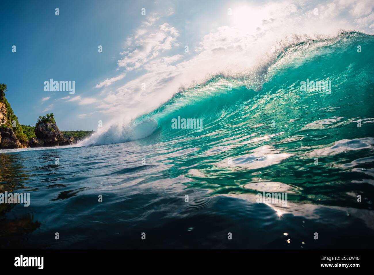 Perfect barrel wave in ocean. Breaking wave and sun light Stock Photo ...