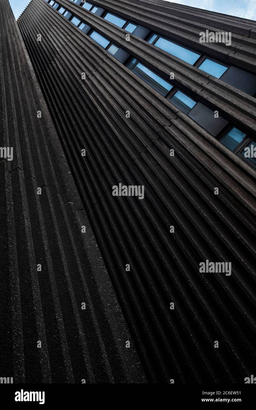 Brutalist architecture. Darkened, formed concrete channels soar skyward ...