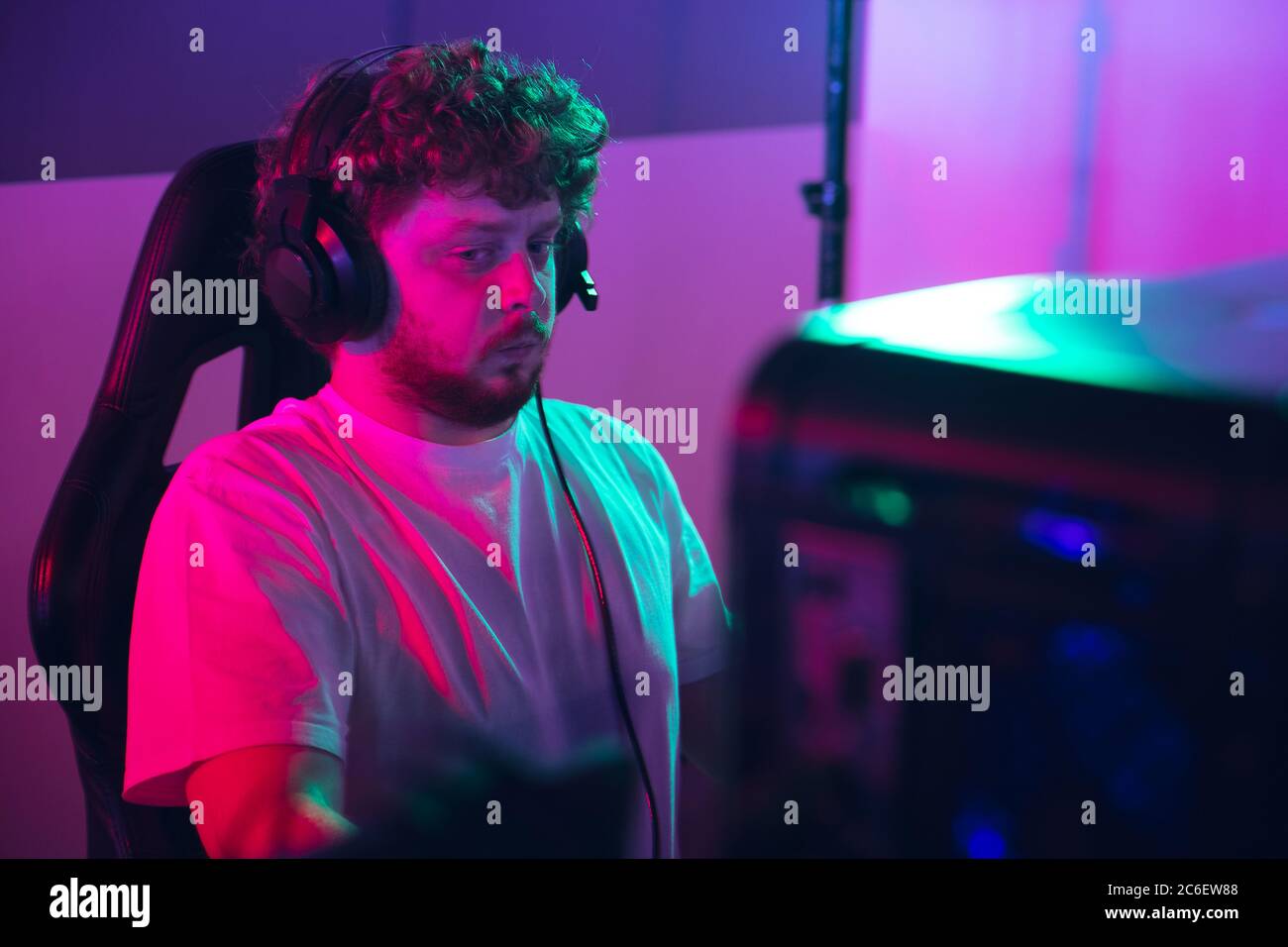 Cyber sport. Fully concentrated professional cybersport gamer playing ...