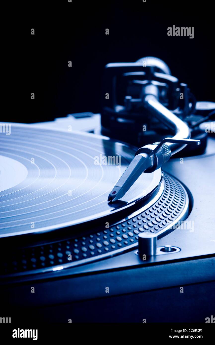 Record player playing LP in dark room, macro picture Stock Photo - Alamy