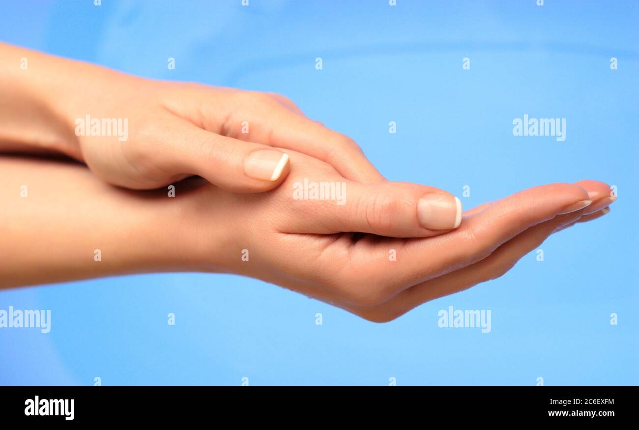 Washing hands in water, macro, blue background Stock Photo - Alamy