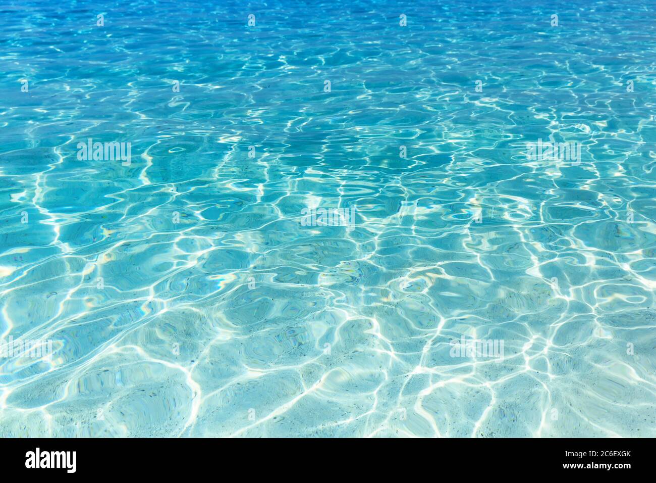 Shining blue water ripple background. Surface of water in swimming pool ...