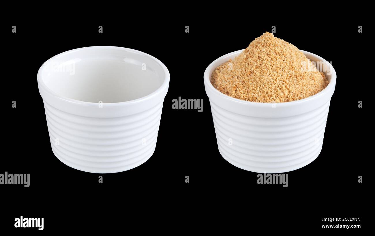 Two bowls one empty the other with ground biscuits Stock Photo - Alamy