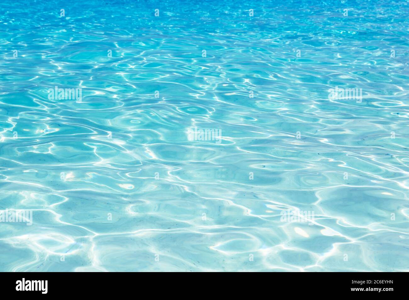 Shining blue water ripple background. Surface of water in swimming pool ...