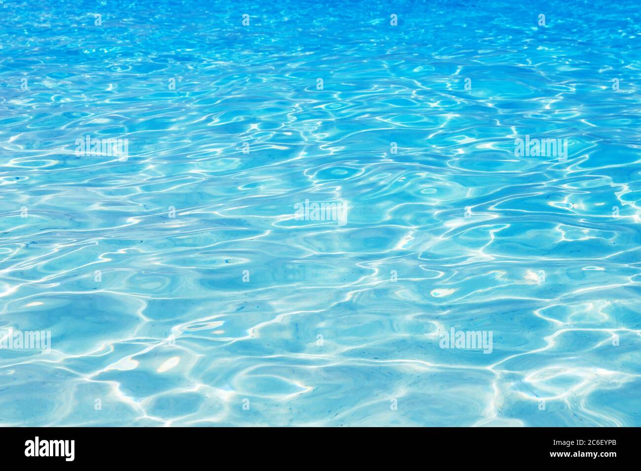 Shining blue water ripple background. Surface of water in swimming pool ...