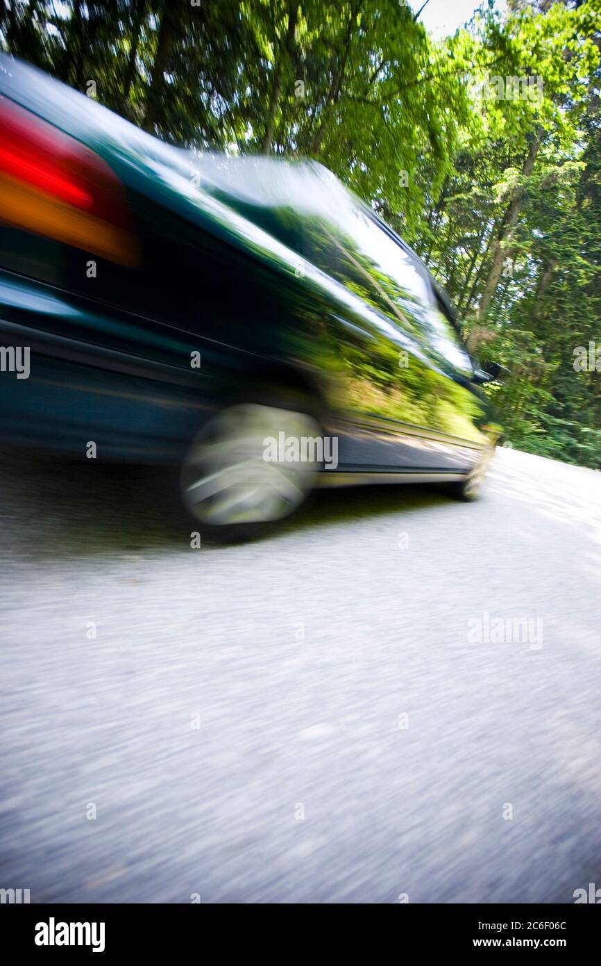 Dynamic motion blur of close car passing by Stock Photo - Alamy