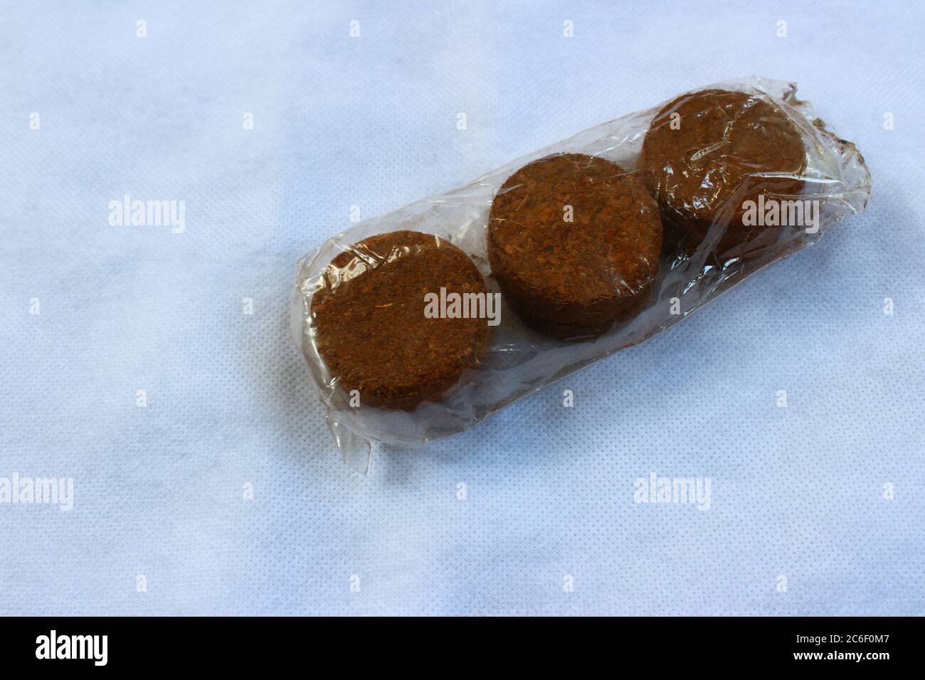 Soil pellets inside a transparent plastic packet Stock Photo - Alamy