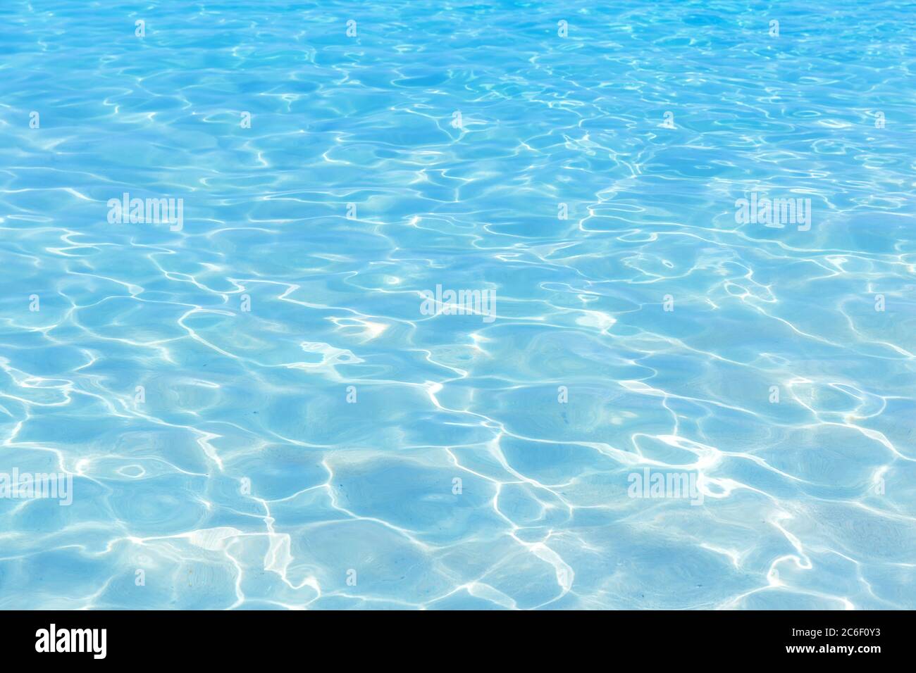 Shining blue water ripple background. Surface of water in swimming pool ...