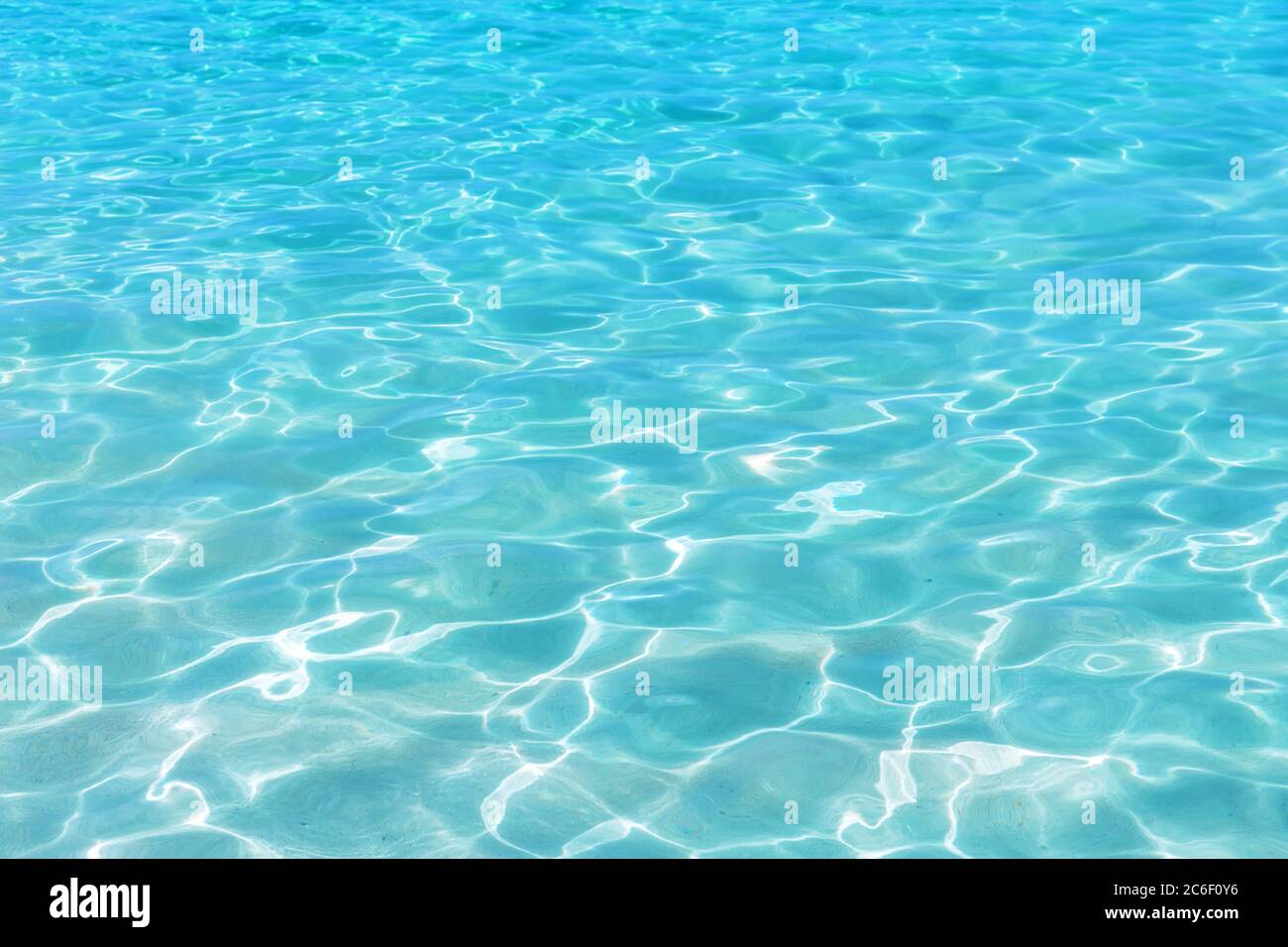 Shining blue water ripple background. Surface of water in swimming pool ...