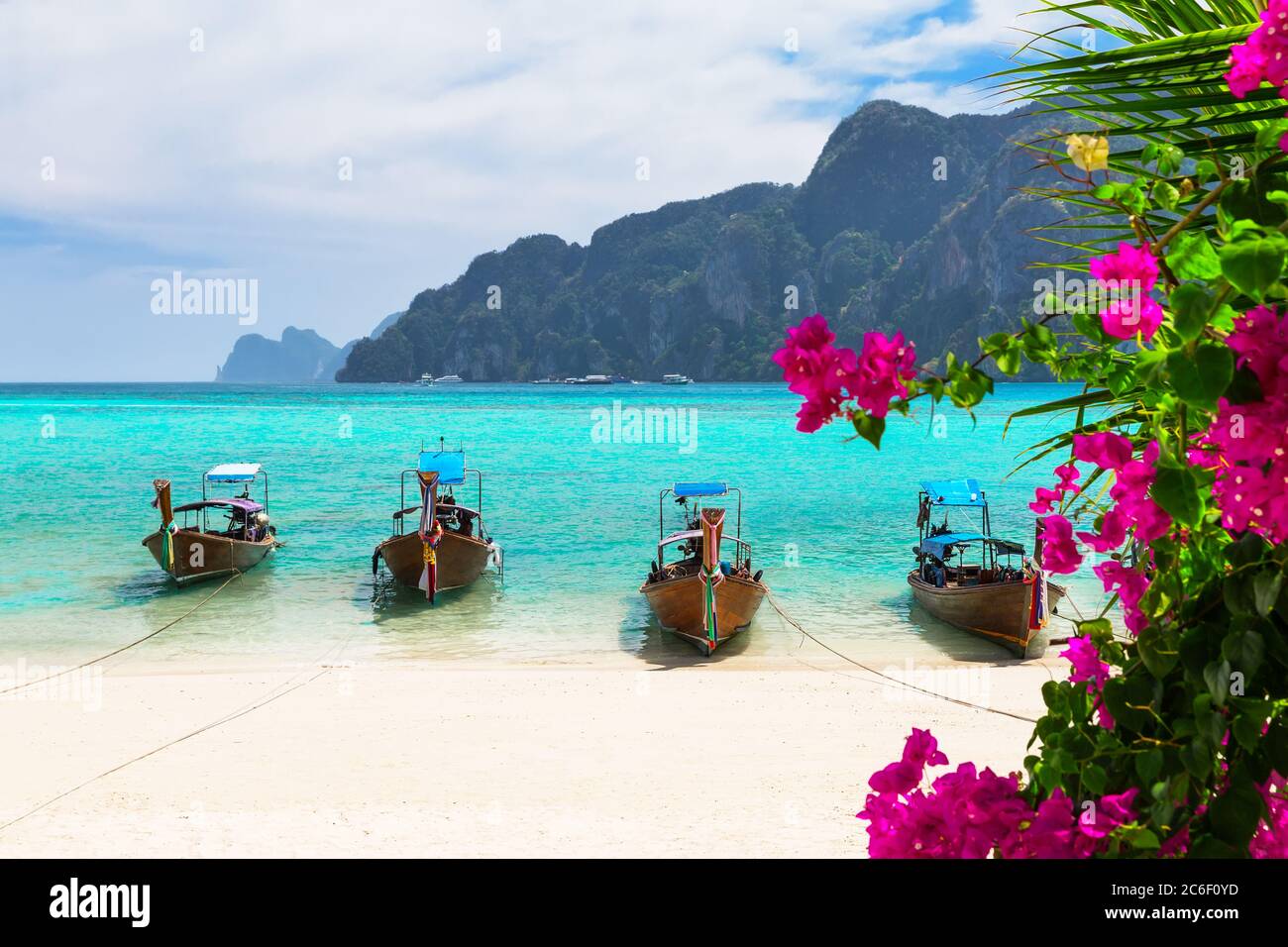Thai traditional wooden longtail boats and beautiful sand beach with ...