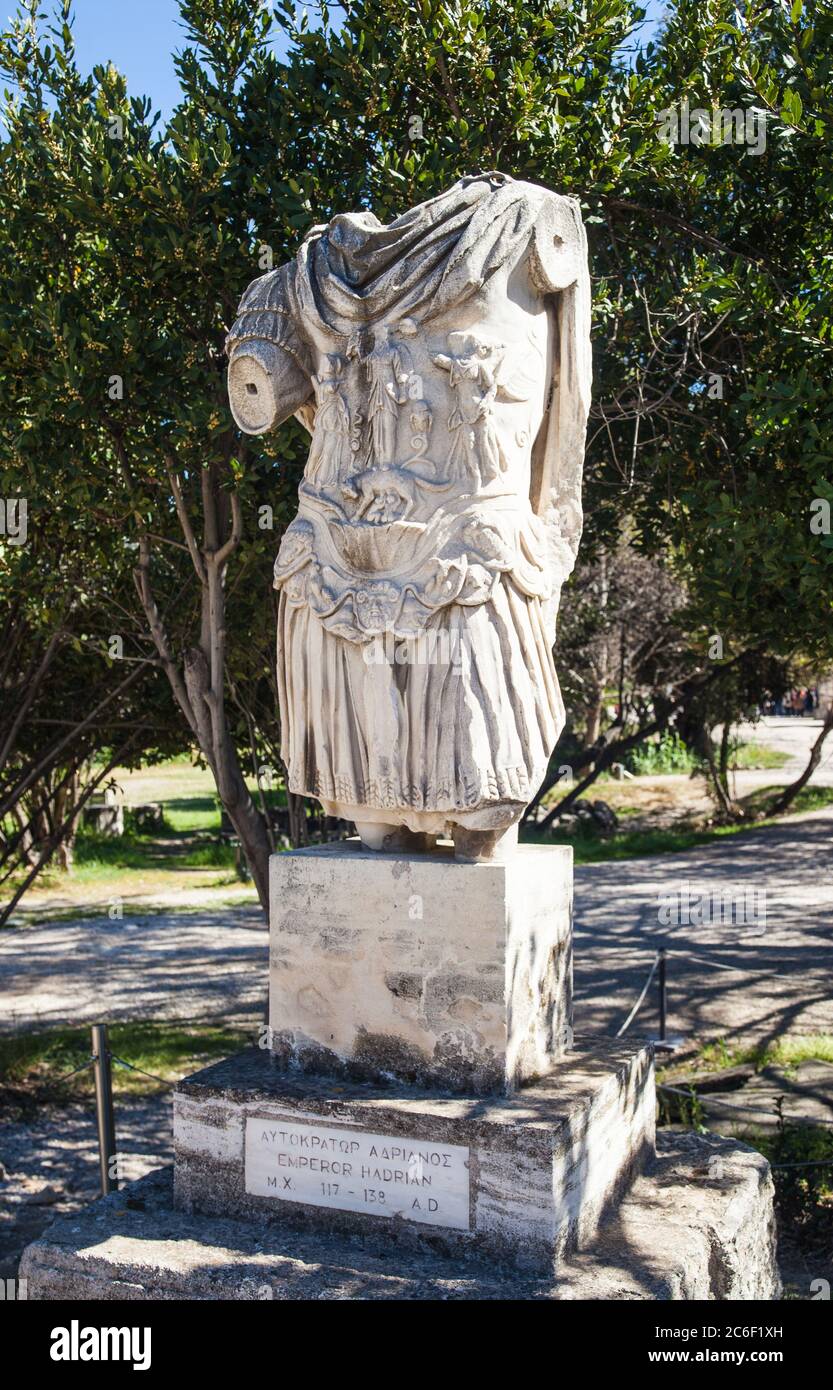 Statue of the torso of Hadrian standing in the ancient Agora of Athens ...