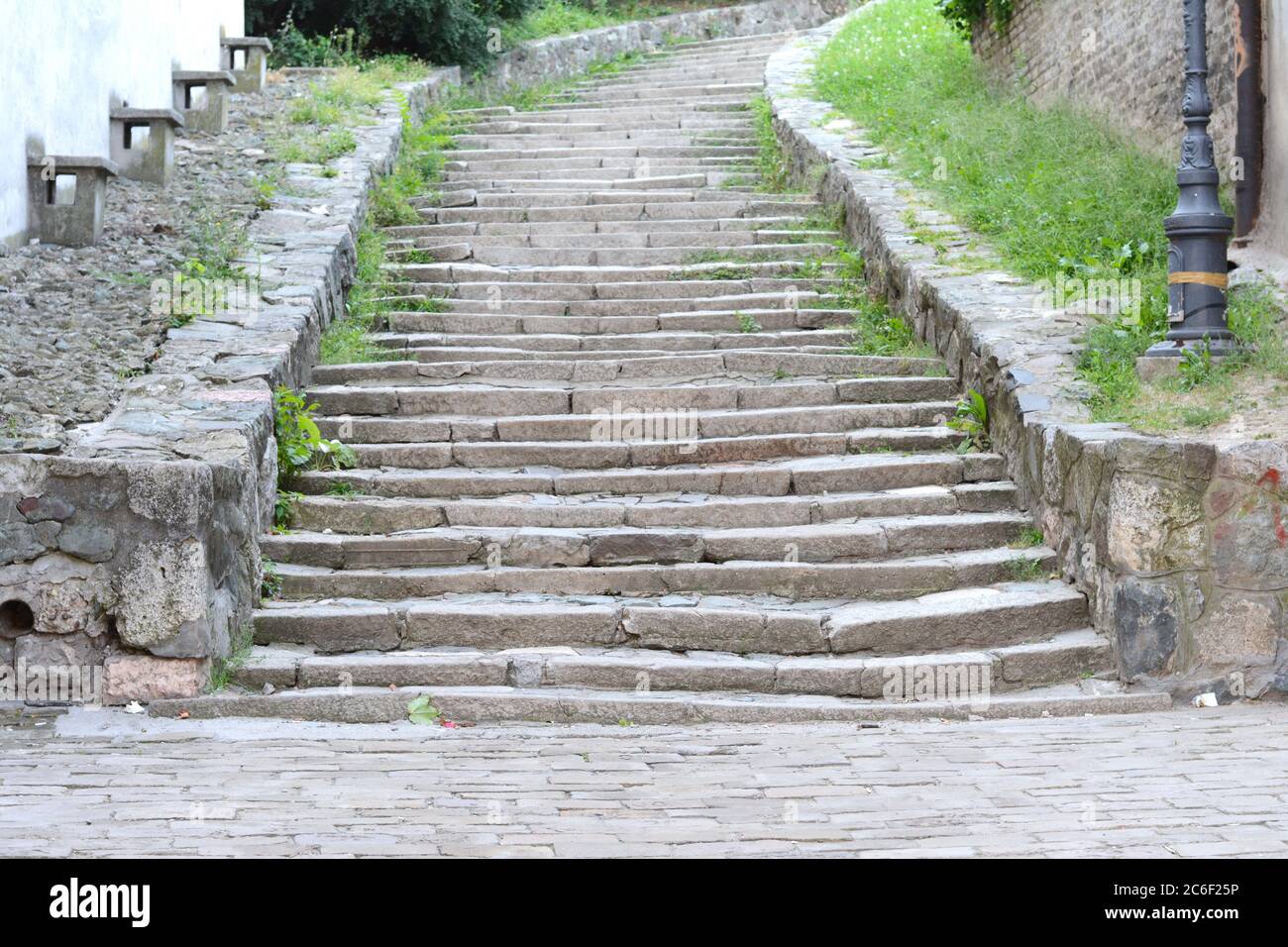 old stairs covered with grass. old stone steps in the fortress. Novi ...