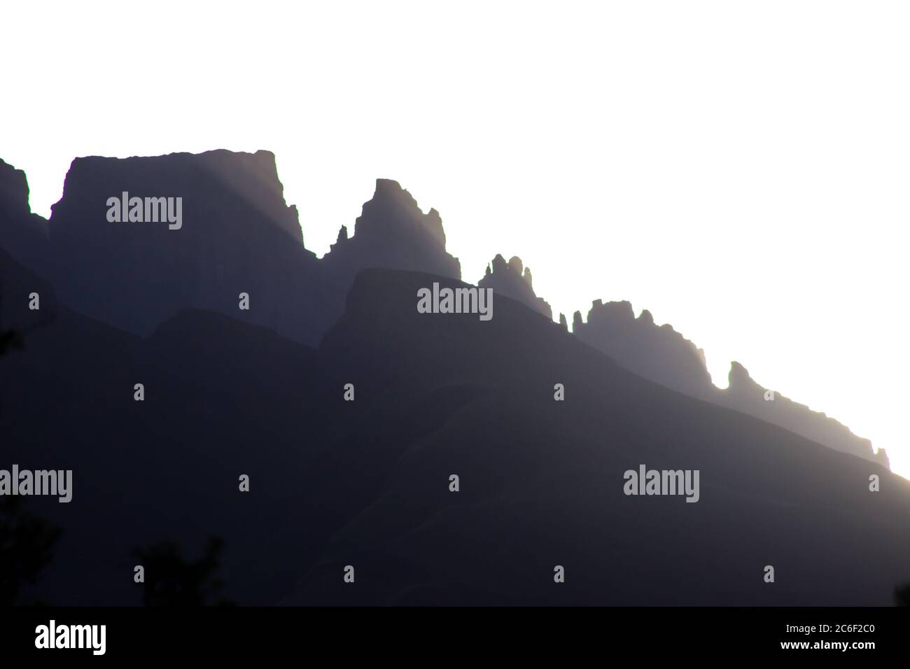 The last rays of the setting sun shinning through the Pinnacles of the ...