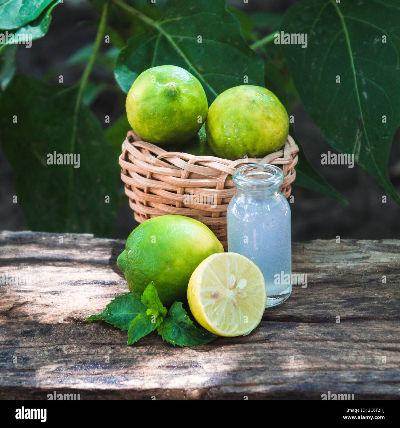 still life with lemons and lemon juice in a small glass jar Stock Photo ...