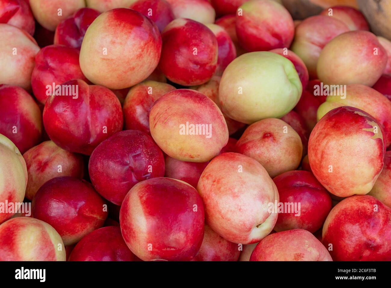 Fresh and tasty natural peach in a market stall Stock Photo - Alamy