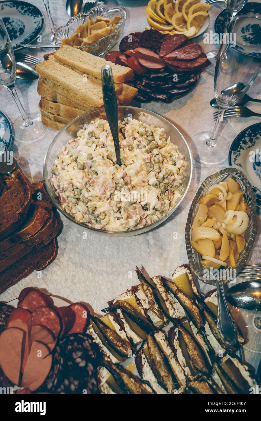 typical russian celebration table setting with traditional Olivier ...