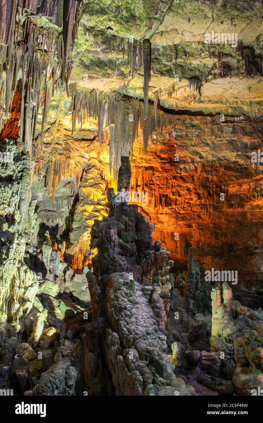 Colorfully illuminated limestone cave, Castellana, Italy Stock Photo ...