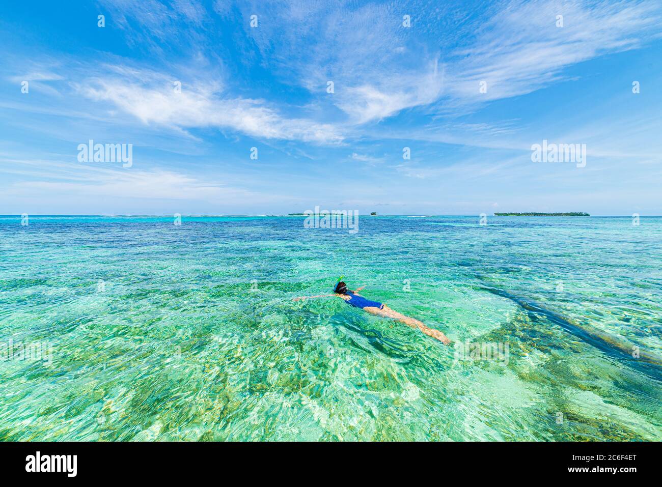 Woman snorkeling in caribbean on coral reef tropical turquoise blue ...