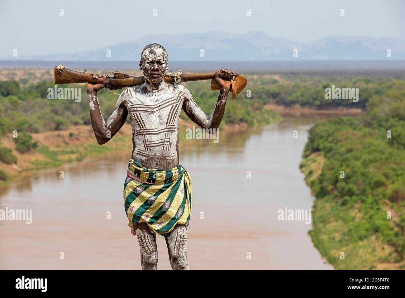 Painted black man with old Lee–Enfield bolt-action army rifle of the ...