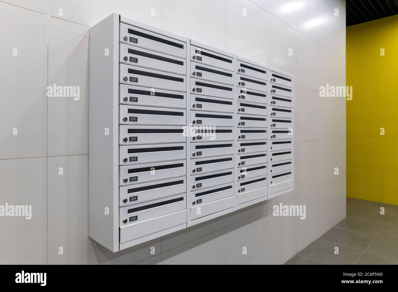 Mailboxes on the wall in an apartment building Stock Photo - Alamy