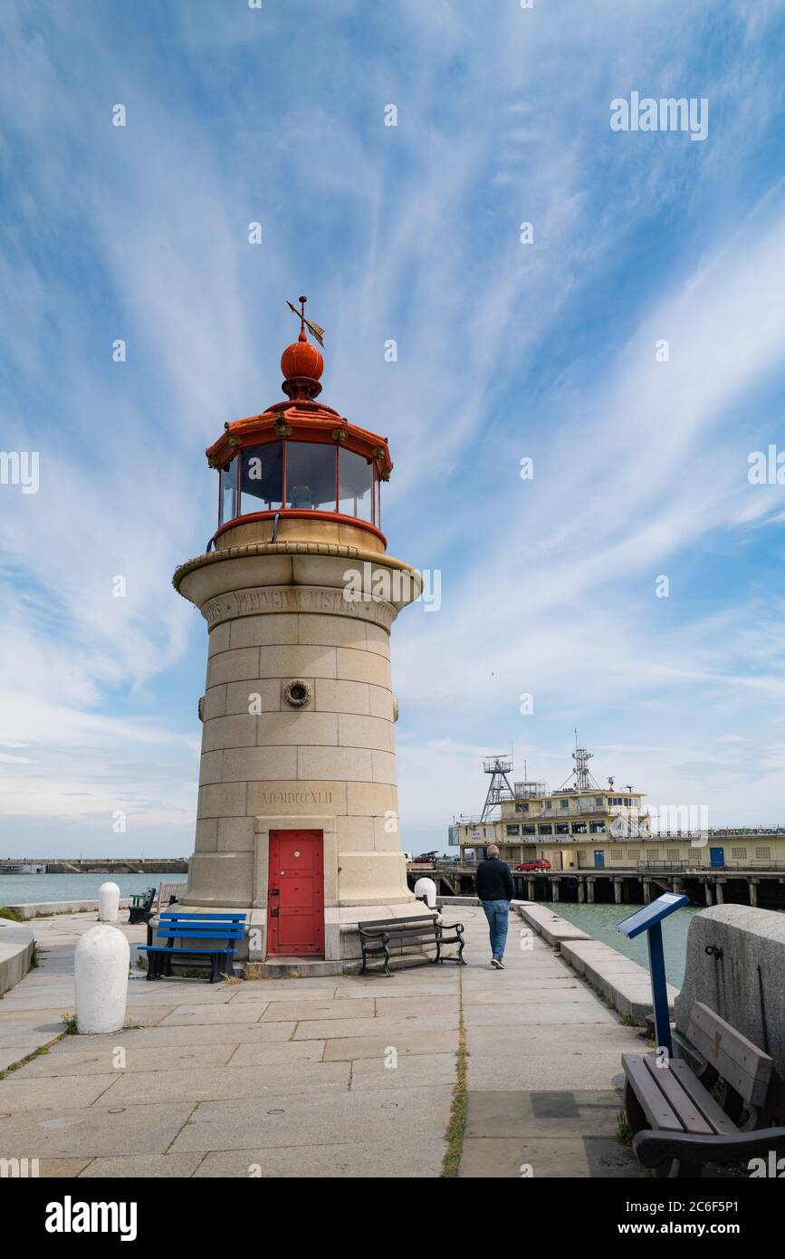 Ramsgate, UK - June 7 2020 A local man walks around the Lighthouse on ...
