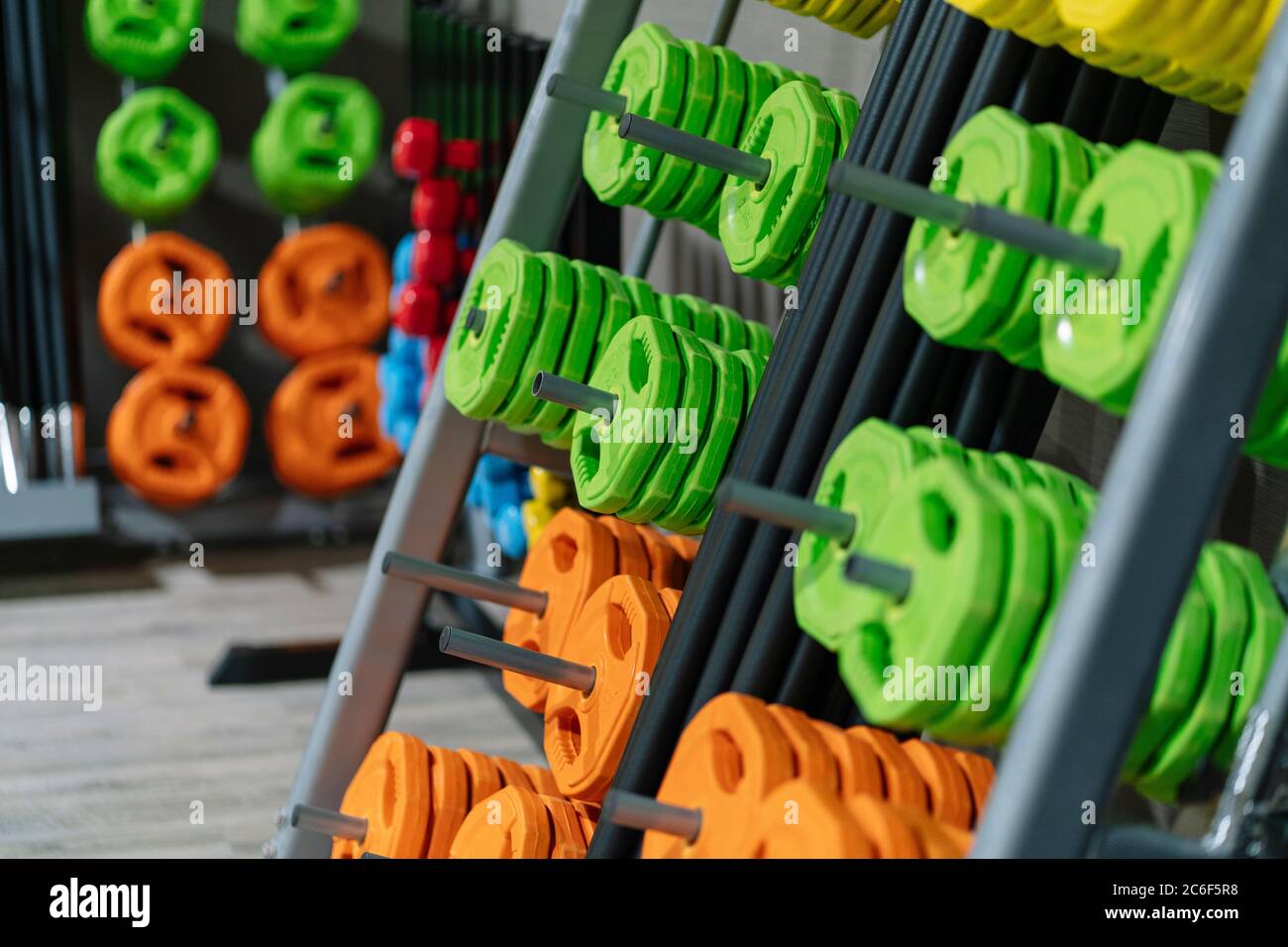 Colored dumbbells placed in the gym Stock Photo - Alamy