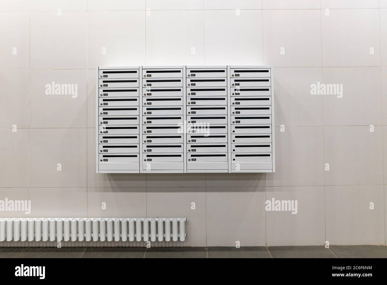 Mailboxes on the wall in an apartment building Stock Photo - Alamy