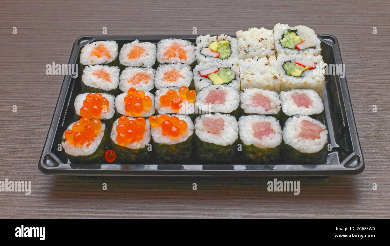 Two Dozen Sushi Rolls at Tray Japanese Cuisine Takeaway Stock Photo - Alamy