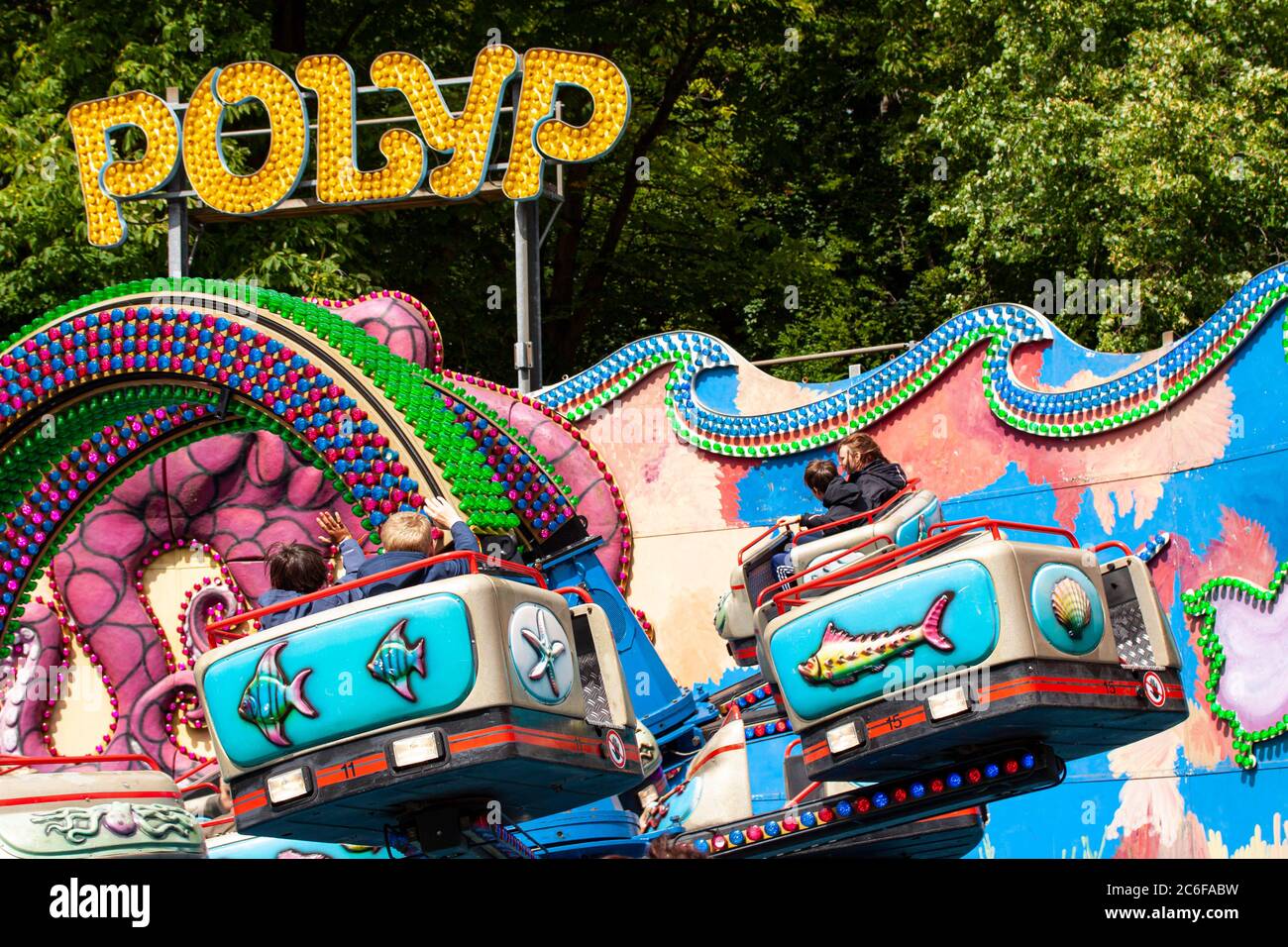Polyp amusement ride at funfair park in daytime. The Polyp has ...