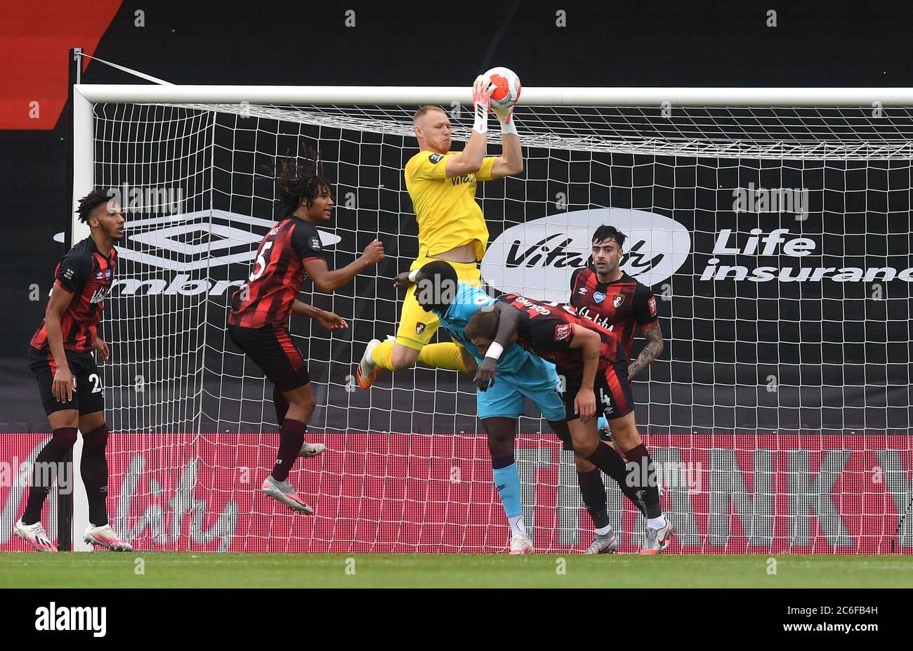 Bournemouth goalkeeper Aaron Ramsdale (centre) makes a save during the ...