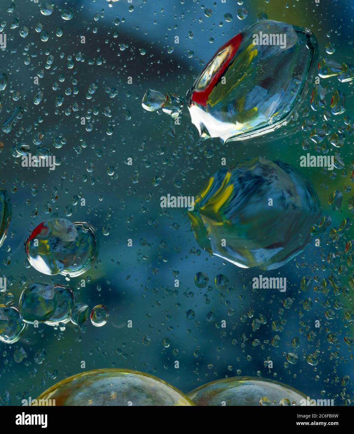 Colour infused water droplets, bubbles, natural environmental portrait ...