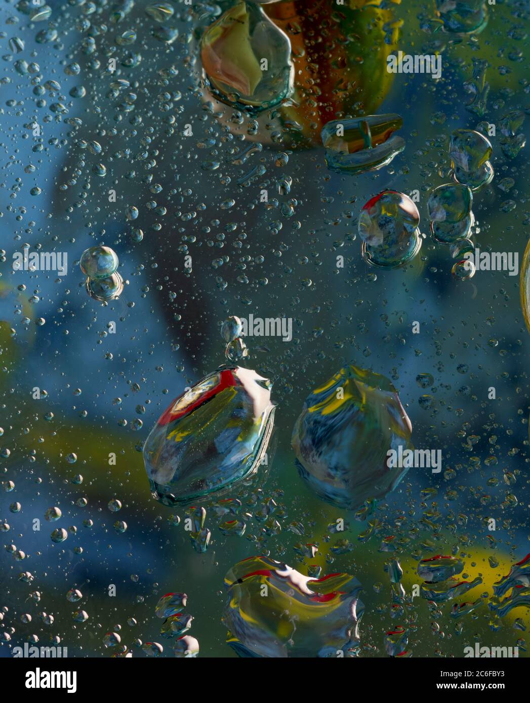 Colour infused water droplets, bubbles, natural environmental portrait ...