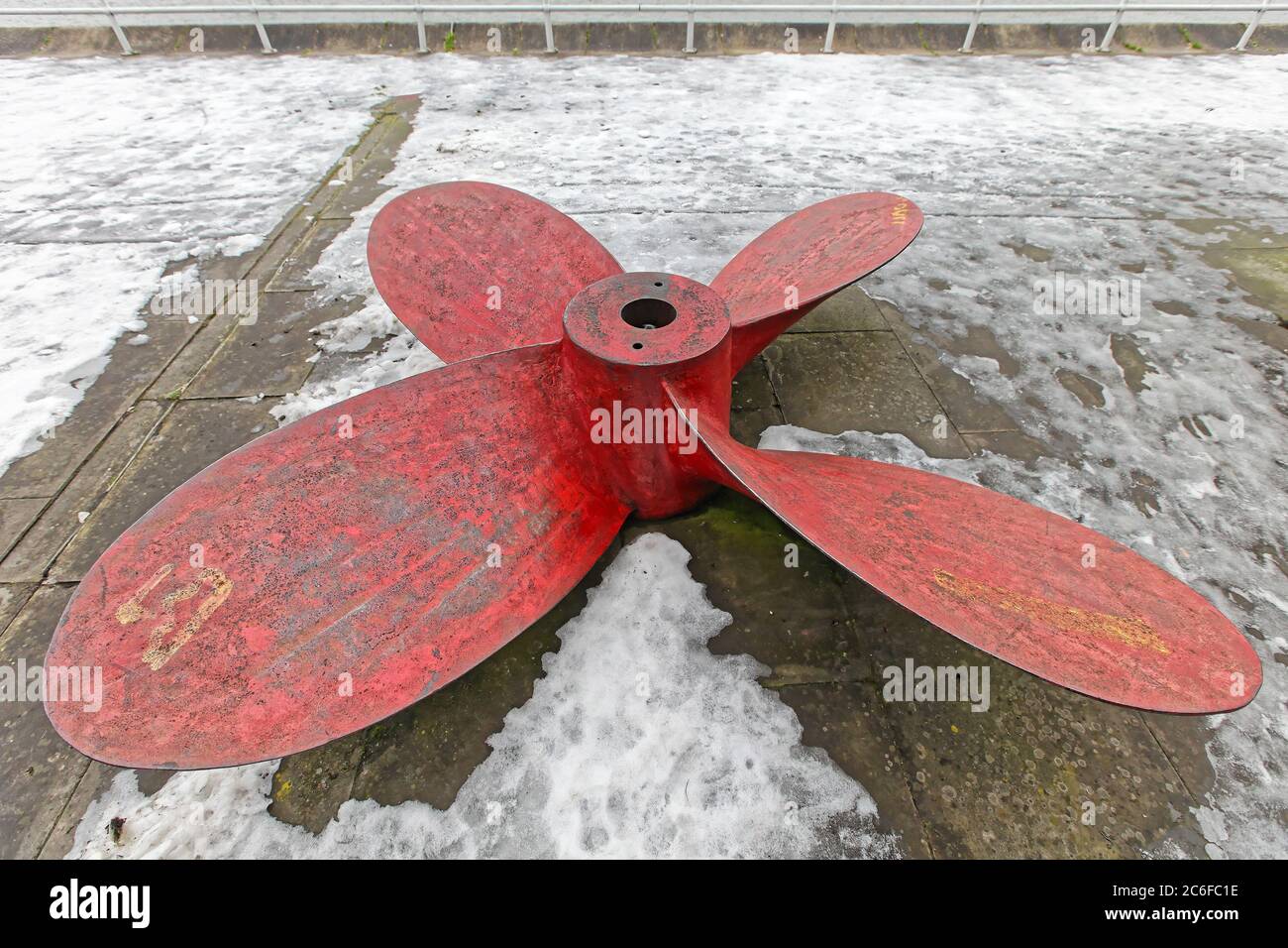 Big Red Propeller With Four Blades at Snow Dock Stock Photo - Alamy