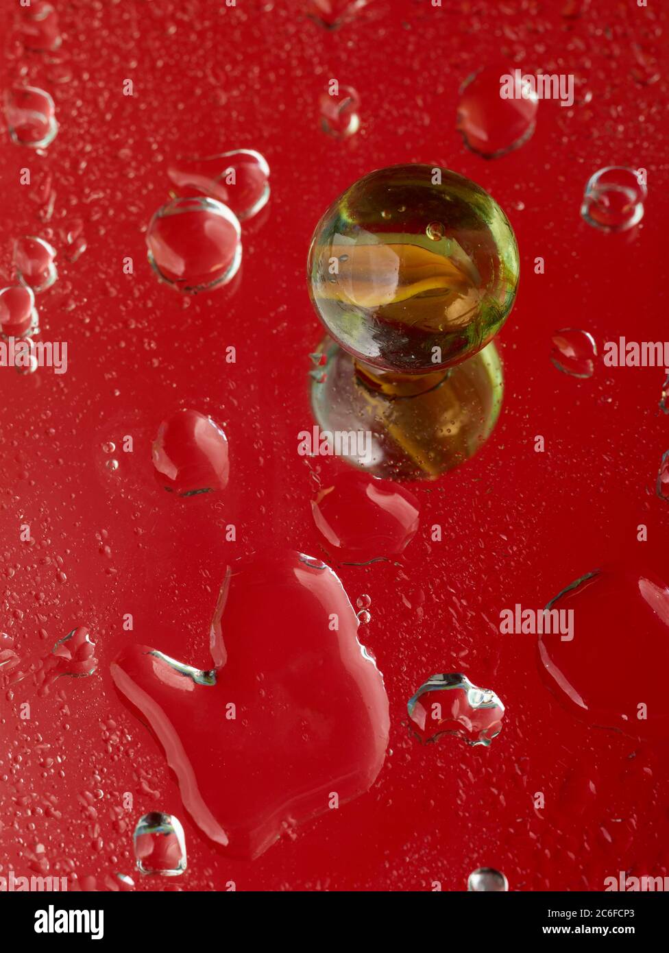 Red colour, water drops on solid background symbolising passion Stock ...