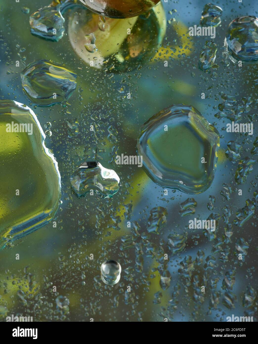 Single glass marble and reflection with a colour infused background and ...