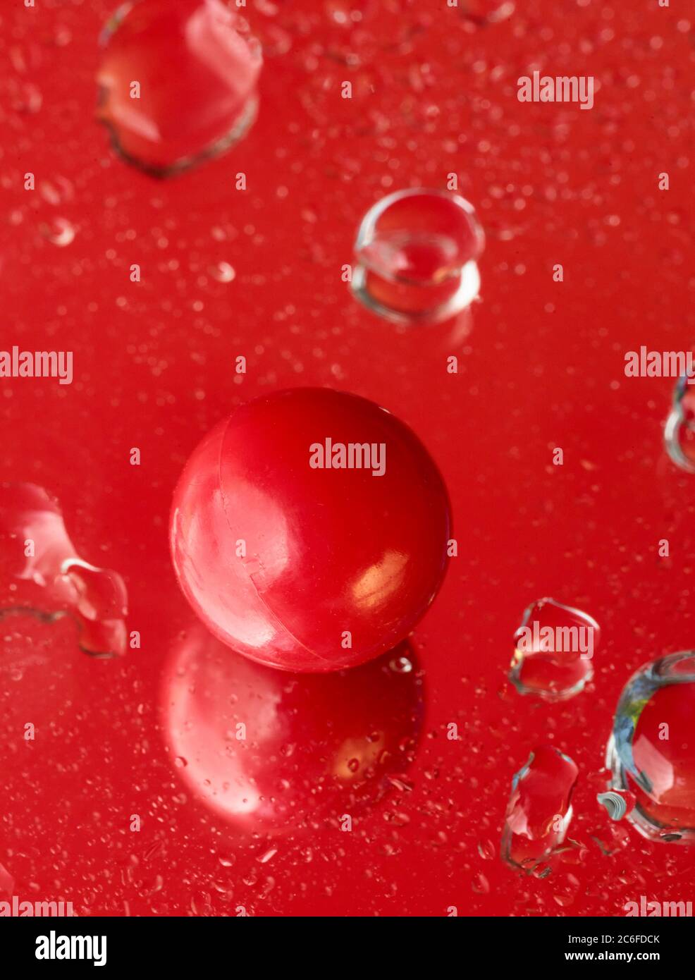 Red colour, water drops on solid background symbolising passion Stock ...