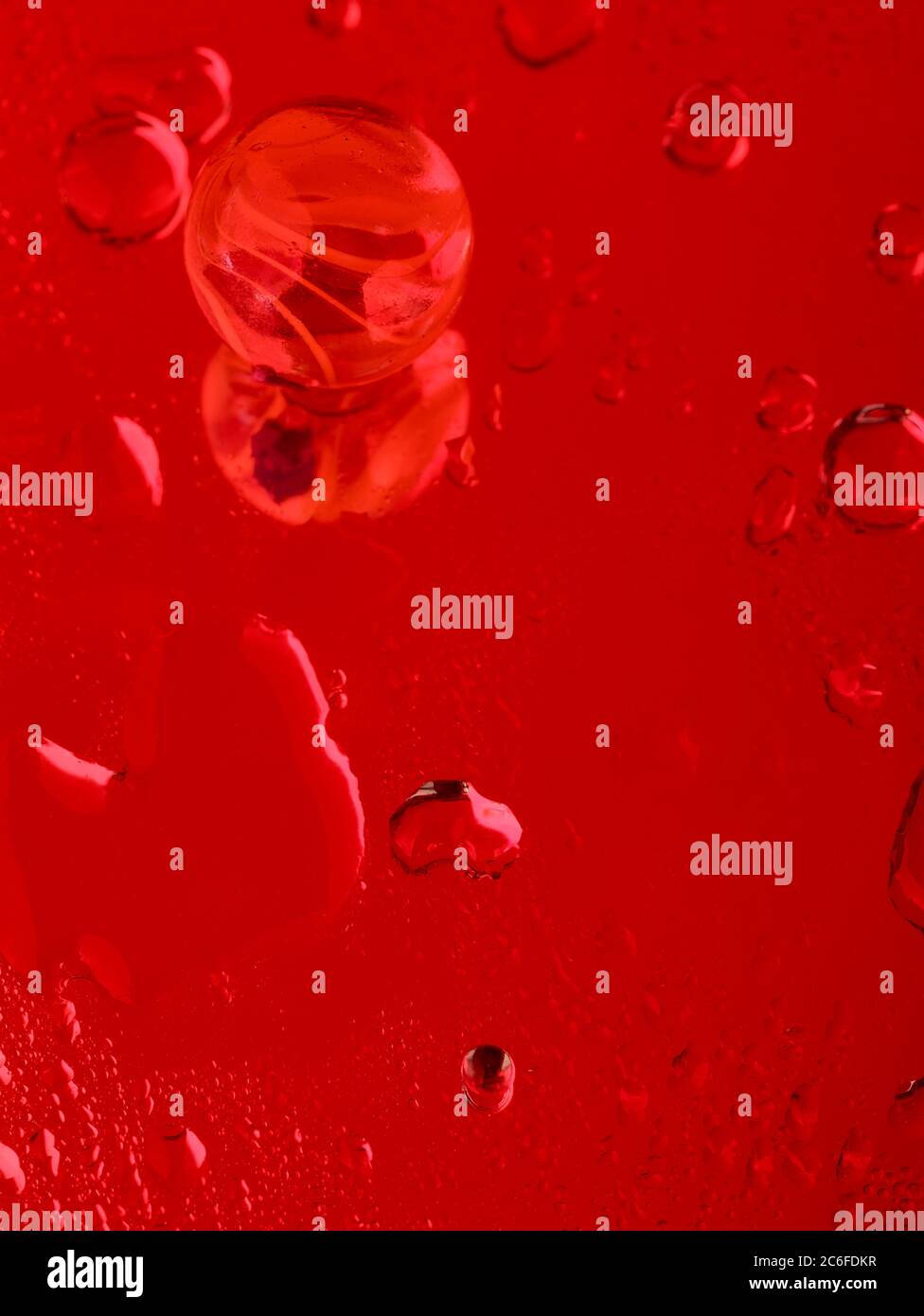 Red colour, water drops on solid background symbolising passion Stock ...