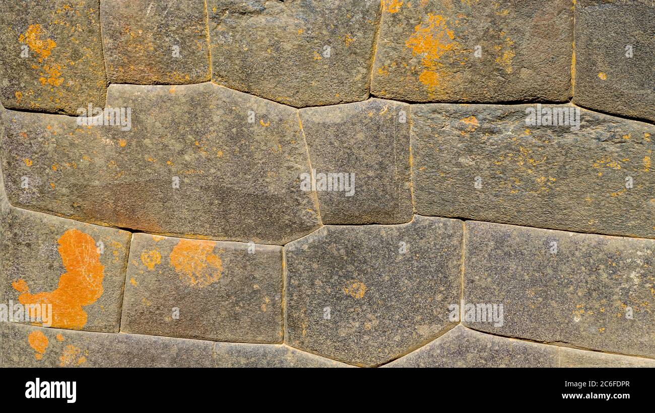 inca stone wall with perfect shaped granite and fitting stones, orange ...