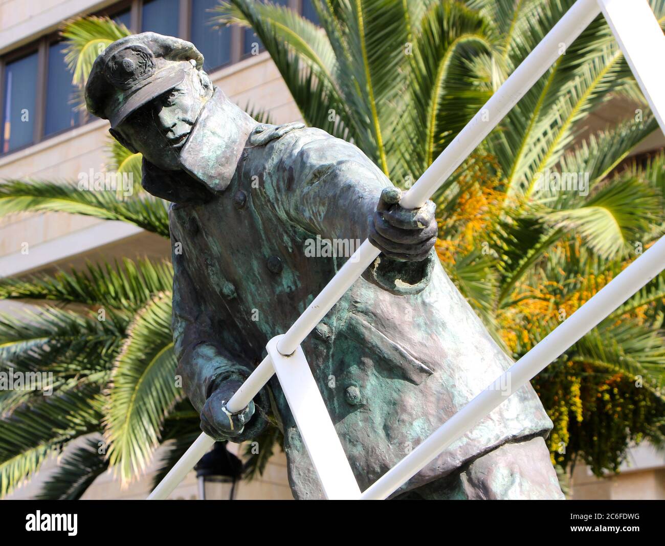 Close up Sculpture of a merchant sailor standing at the bow of a boat ...