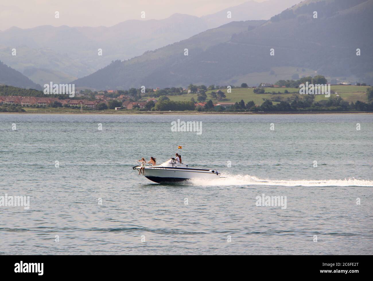 Speed boat travelling across the bay of Santander Spain on a summer ...